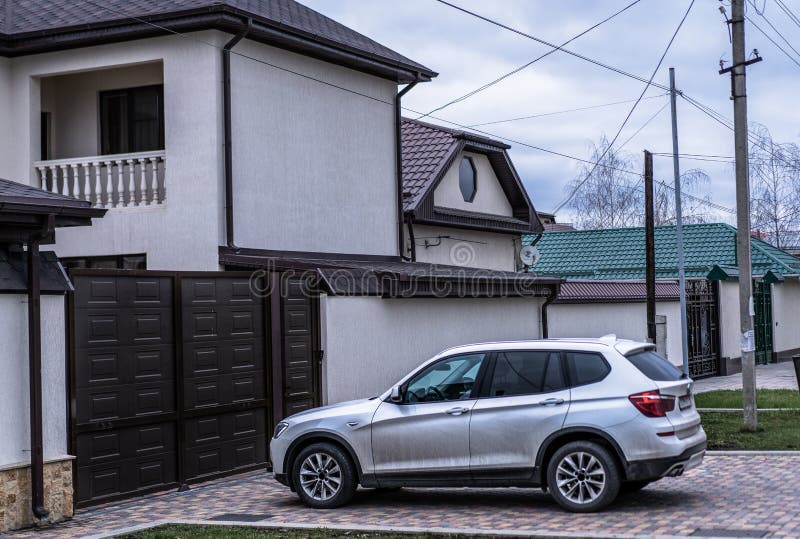 The Car is Parked in Front of the Gate of the House Stock Photo - Image ...