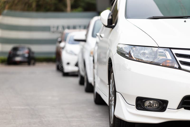 Car Parked Neatly Inside an Outdoor Parking Lot Stock Image - Image of ...