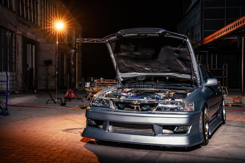 Car Parked on the Side of the Street with Its Hood Propped Open Stock ...