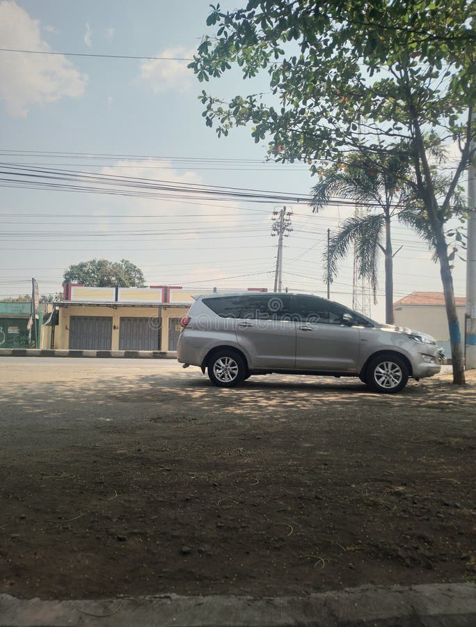Car parked under the tree stock image. Image of parked - 295296801