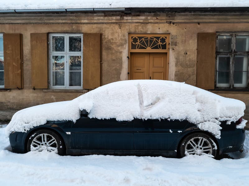 The Car in the Parking Lot is Completely Covered with Snow. Problems ...