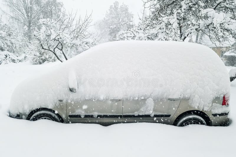 The Car in the Parking Lot is Completely Covered with Snow. Problems ...