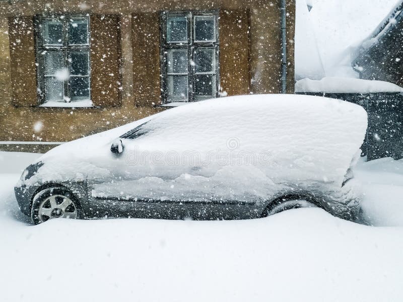 The Car in the Parking Lot is Completely Covered with Snow. Problems ...