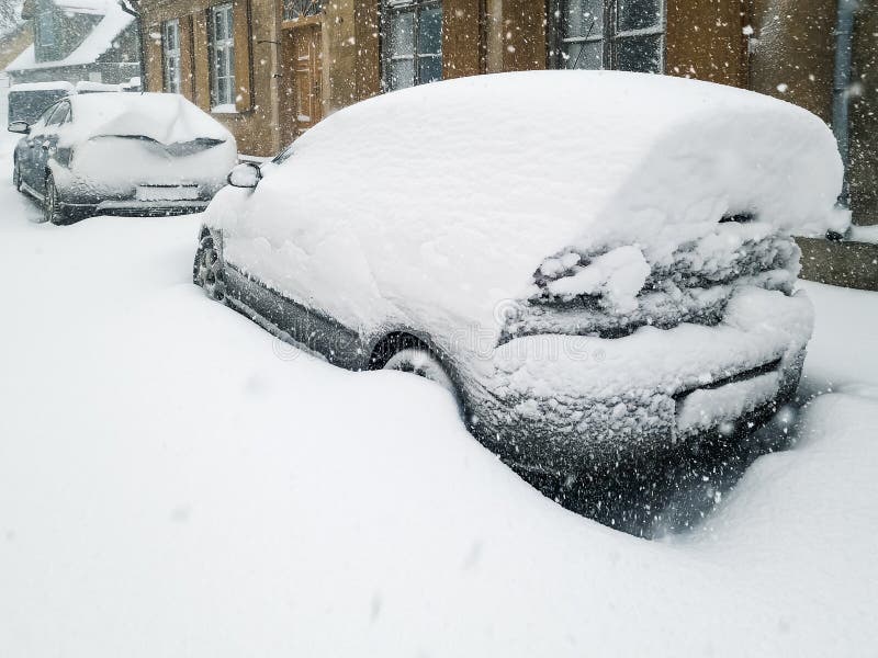 The Car in the Parking Lot is Completely Covered with Snow. Problems ...