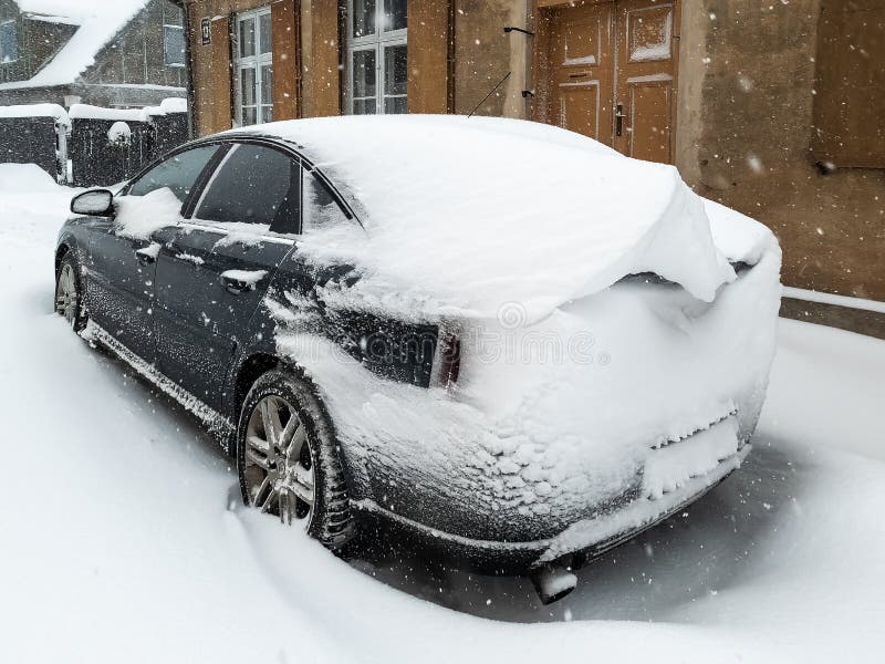 The Car in the Parking Lot is Completely Covered with Snow. Problems ...