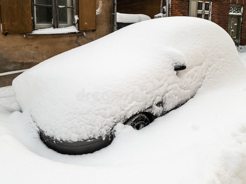 The Car in the Parking Lot is Completely Covered with Snow. Problems ...