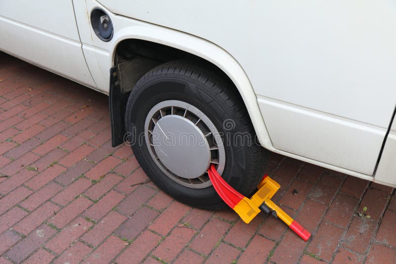 Car parking wheel clamp stock image. Image of cologne - 250897105