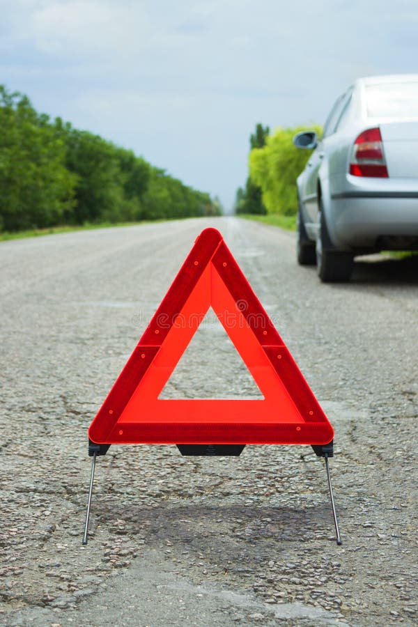 Car with Problems and a Red Triangle To Warn Other Road Users Stock ...