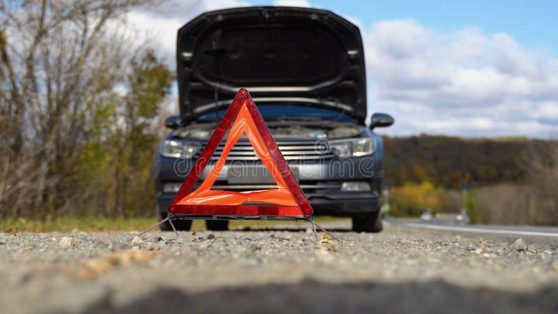 Car with Problems and a Red Triangle To Warn Other Road Users Stock ...