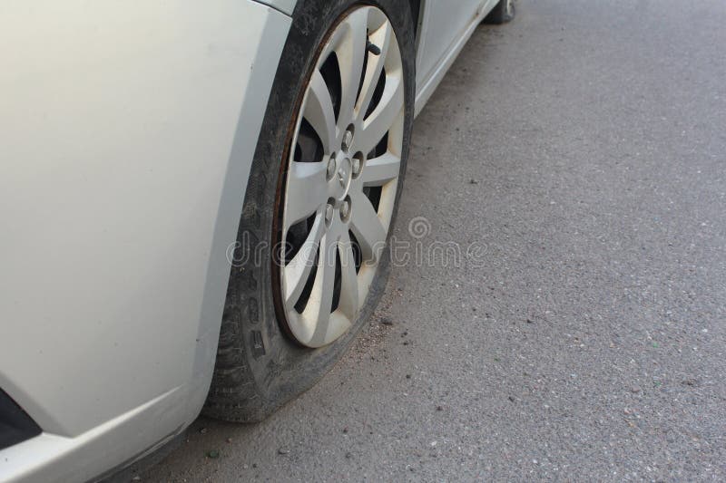 Car with Punctured Flat Tire Parked on Roadside Stock Image - Image of ...