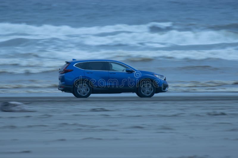 Car racing on the beach stock photo. Image of ocean - 286264588