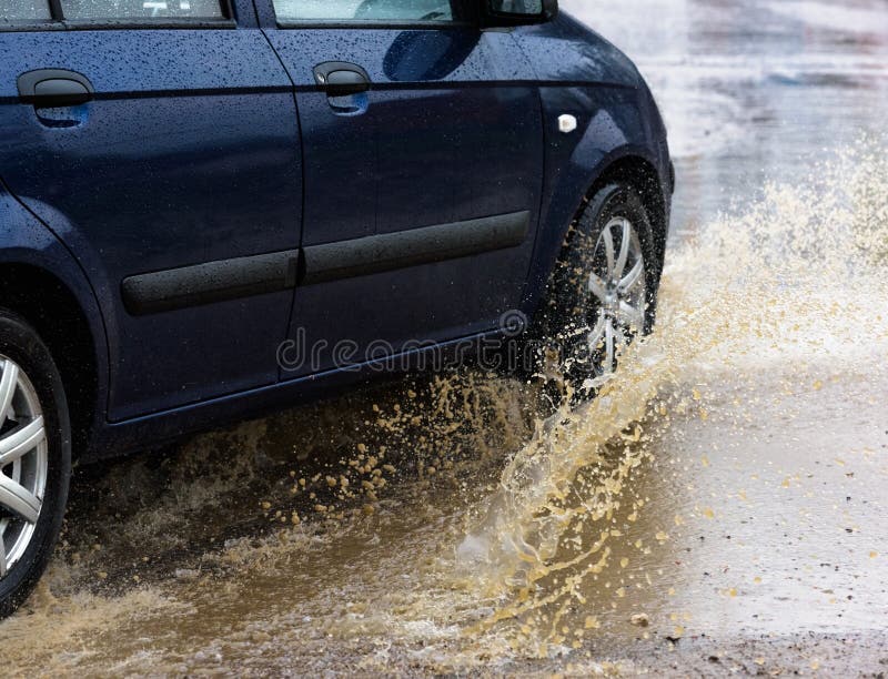 Car Rain Puddle Splashing Water Stock Photo - Image of spray, motion ...