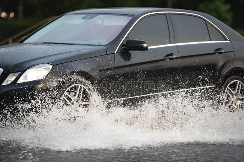 Car Rain Puddle Splashing Water Stock Photo - Image of flowing, heavy ...