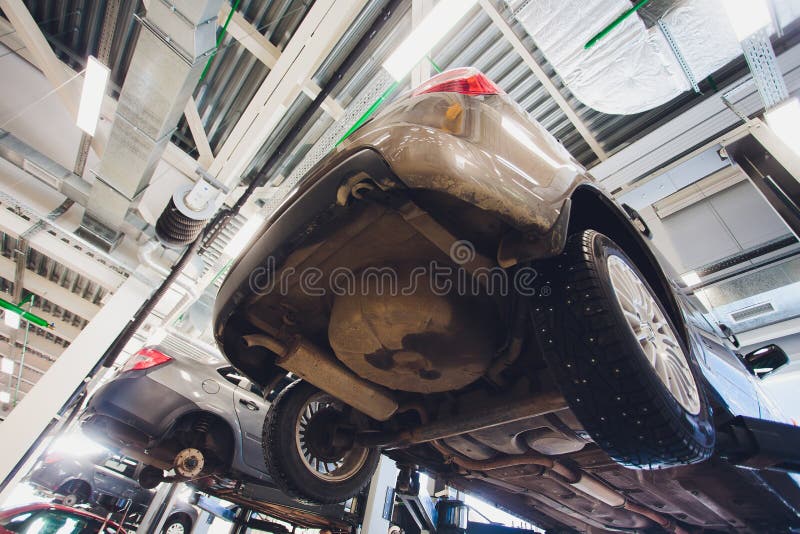 Car Raised on Car Lift in Autoservice. Stock Photo - Image of centre ...