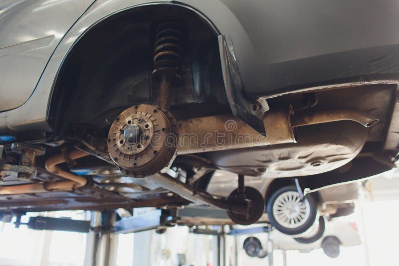 Car Raised on Car Lift in Autoservice. Stock Photo - Image of indoor ...