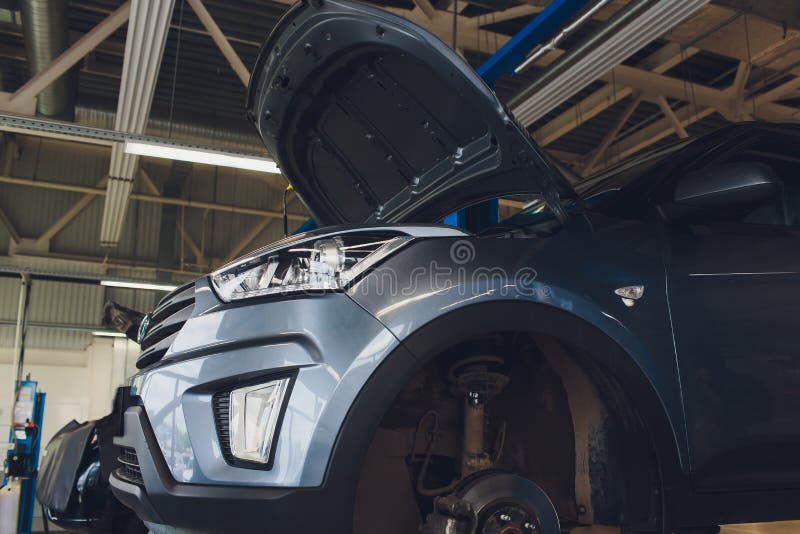 Car Raised on Car Lift in Autoservice. Stock Photo - Image of industry ...