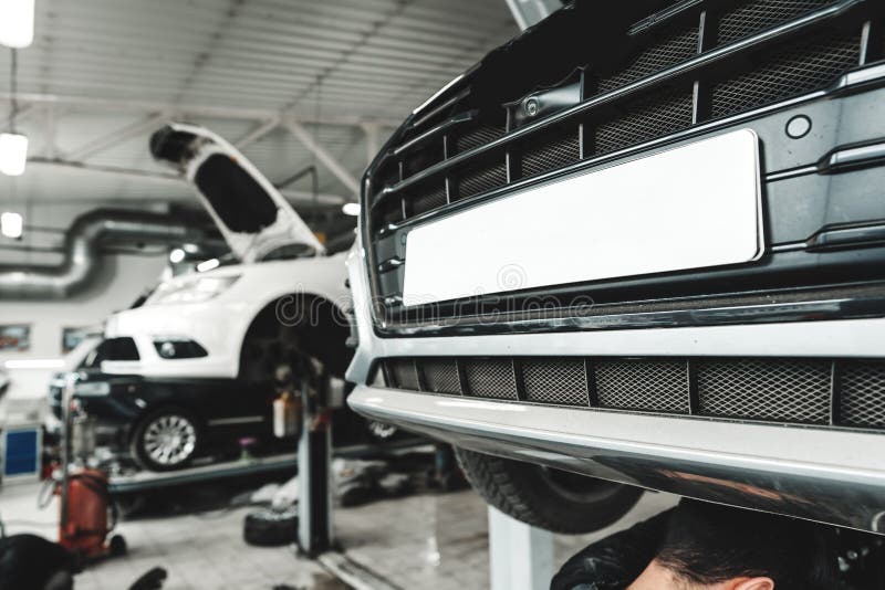 Car Raised on Car Lift in Car Service Shop Stock Photo - Image of ...