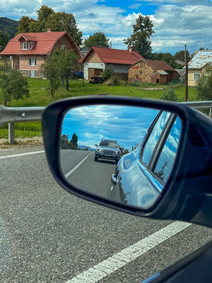 Car Reflection in Side Mirror on Rural Road Stock Photo - Image of ...