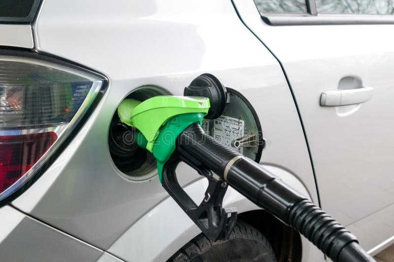 A Car that is Refueled at a Gas Station Stock Image - Image of nozzle ...