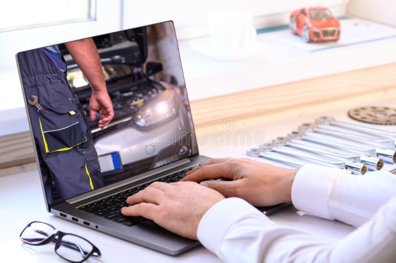 . Car Repair Courses. on the Table are a Computer and Tools for Car ...