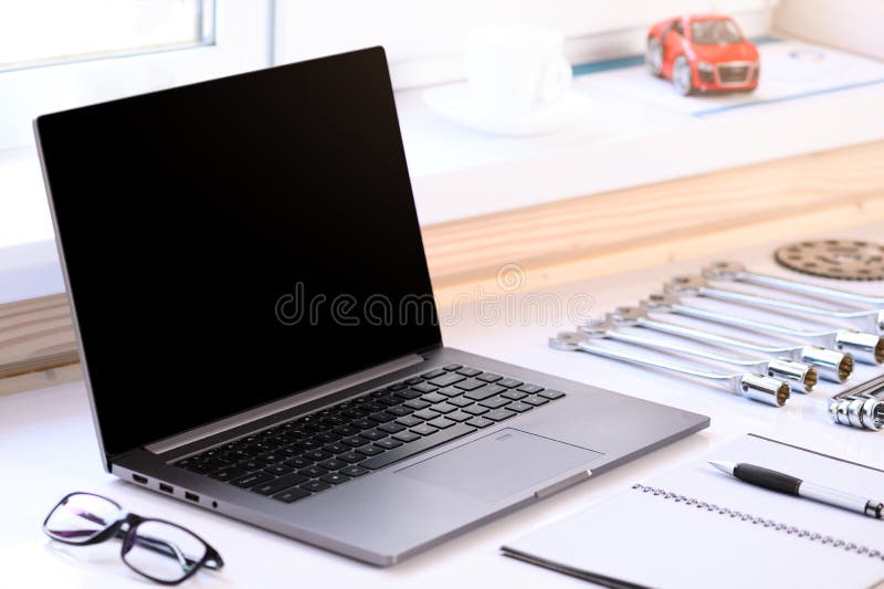 . Car Repair Courses. on the Table are a Computer and Tools for Car ...