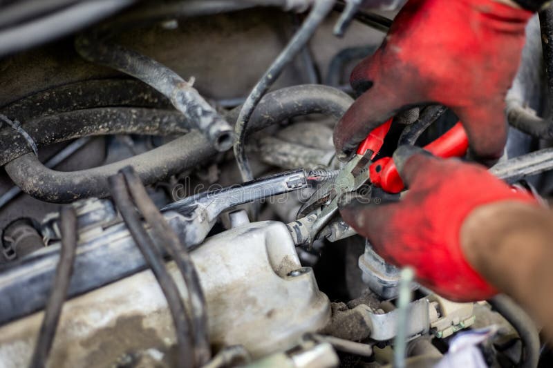 Car Repair. Mechanic Removes the Engine Crankcase Gas Recirculation ...