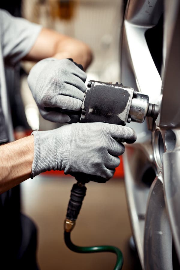 Safety First: an Automechanic is Conducting a Detailed Examination ...