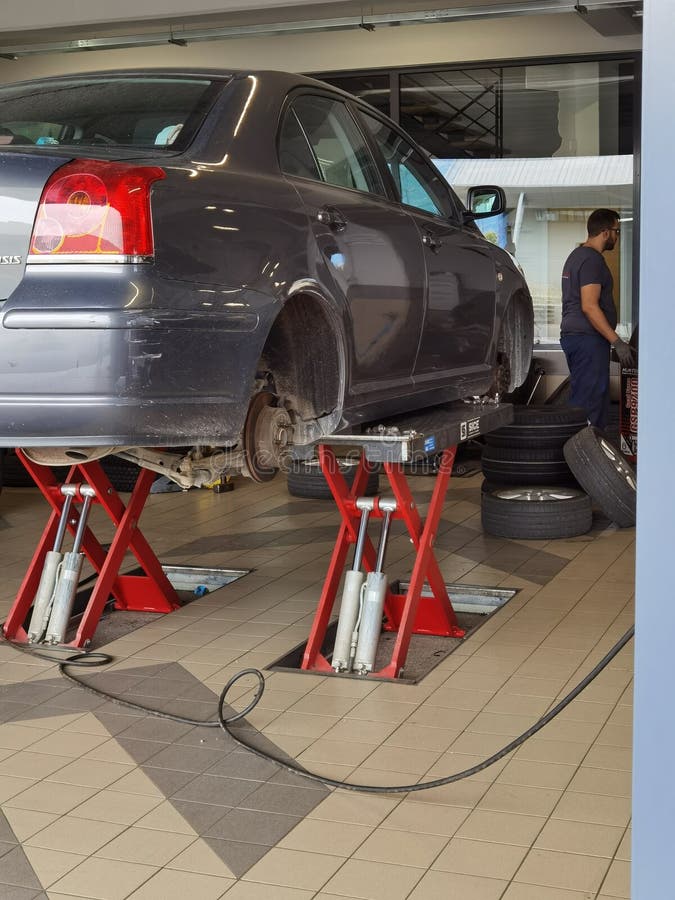 Car Repair Shop Tire Change Editorial Stock Image - Image of person ...