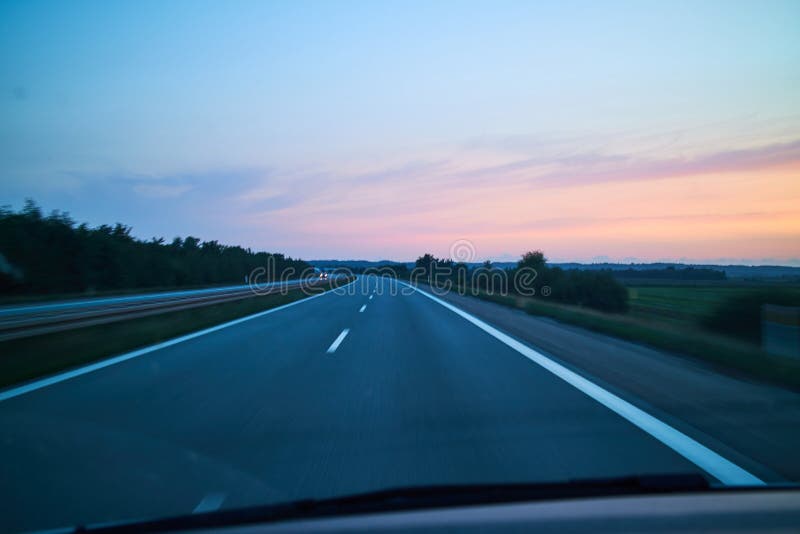 Car Ride in the Country with Purple Sunset Stock Image - Image of ...
