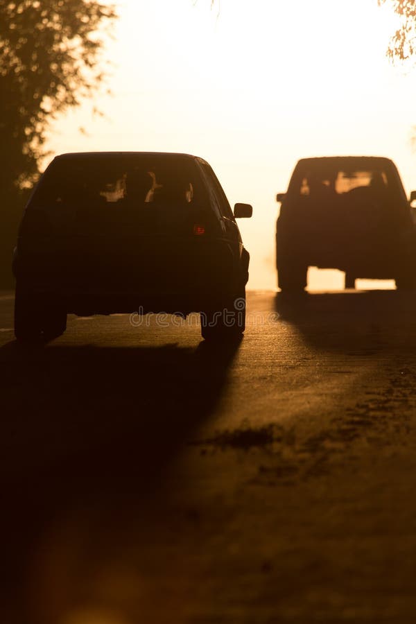 Car Rides on the Road at Sunset Stock Photo - Image of night, desert ...