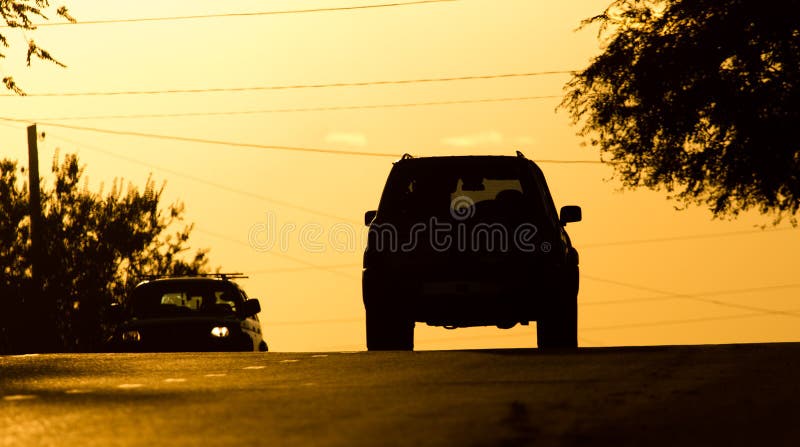 Car Rides on the Road at Sunset Stock Photo - Image of sundown, desert ...