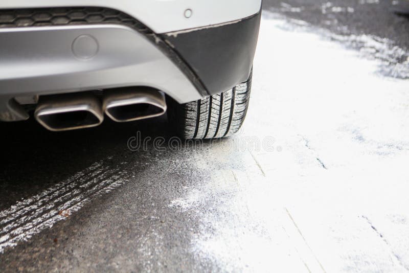 Car Right Back Wheel in a Snowy Road with a Tire Track Stock Image ...