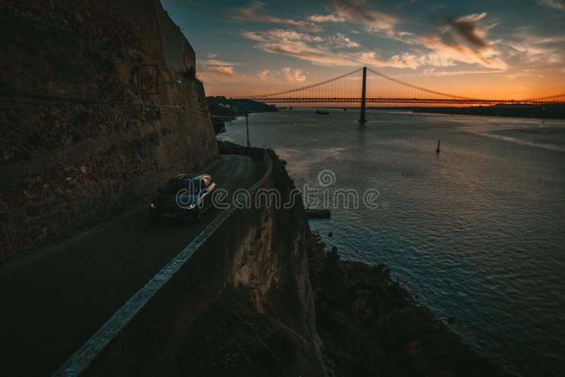 Car on a Road on a Cliff on the Sunset Editorial Image - Image of ...