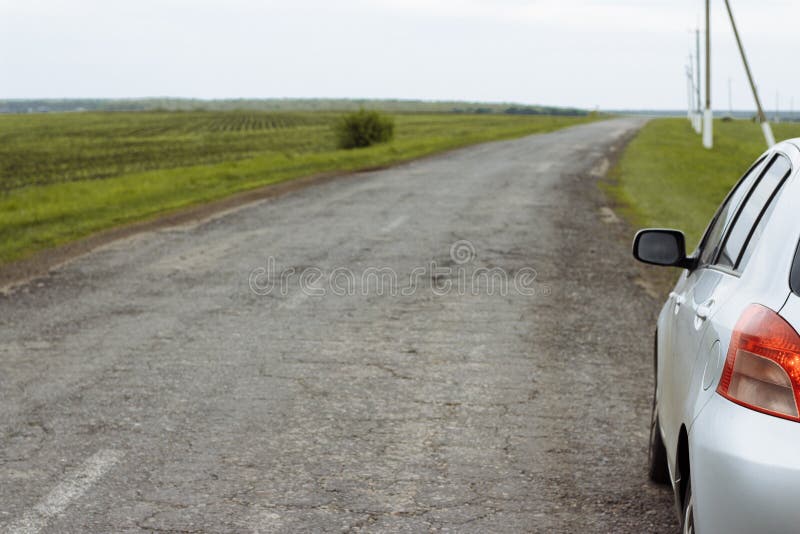 Car on the Road among a Green Field Stock Photo - Image of modern ...