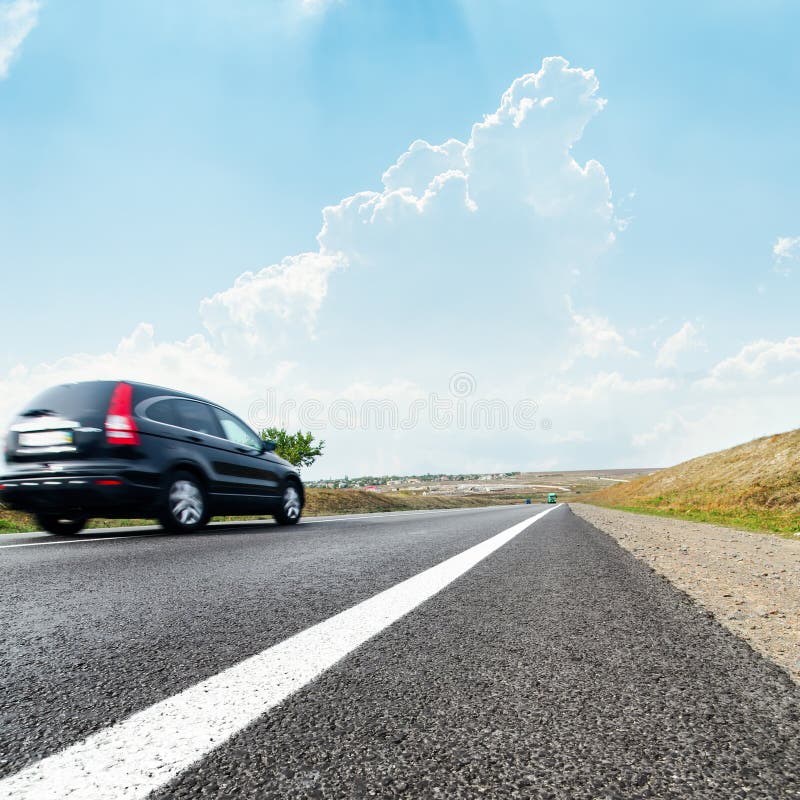 Car on Road in Motion and Blue Sky with Clouds Stock Image - Image of ...