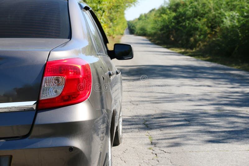 A Car on the Road, a Parked Car on the Road Leading Away into the ...