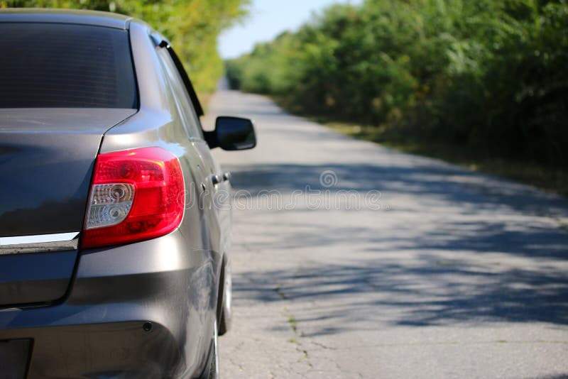 A Car on the Road, a Parked Car on the Road Leading Away into the ...