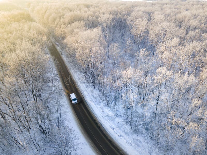 Car on the Road Surrounded by Winter Forest. Aerial Top View Stock ...