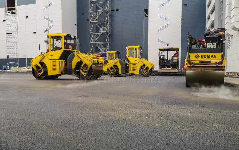Car Rollers for Road Construction and Workers Put Asphalt in the ...