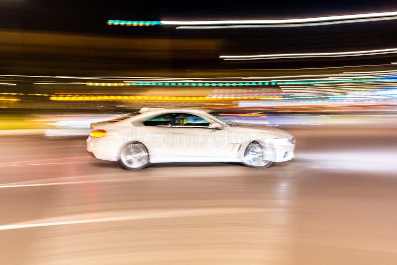 Car Rolling at Full Speed through the City at Night, Image of Panning ...