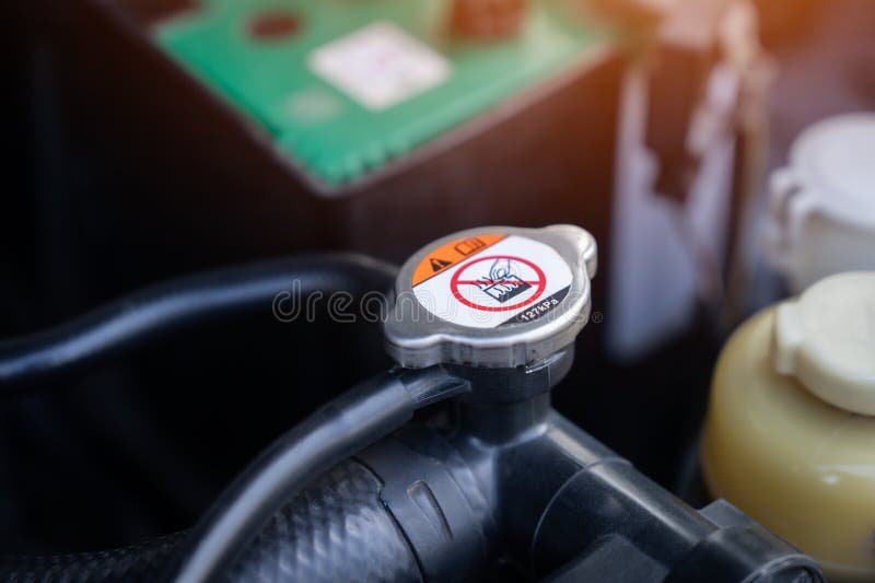 The Car S Radiator Cap Has a "Do Not Open" Sticker on it. the Cap is on ...