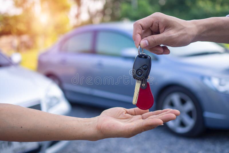 The Car Salesman and the Key To the New Owner Stock Photo - Image of ...