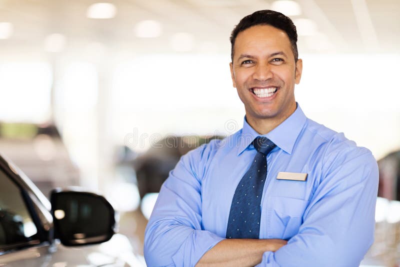 Car salesman in showroom stock image. Image of corporate - 67477595