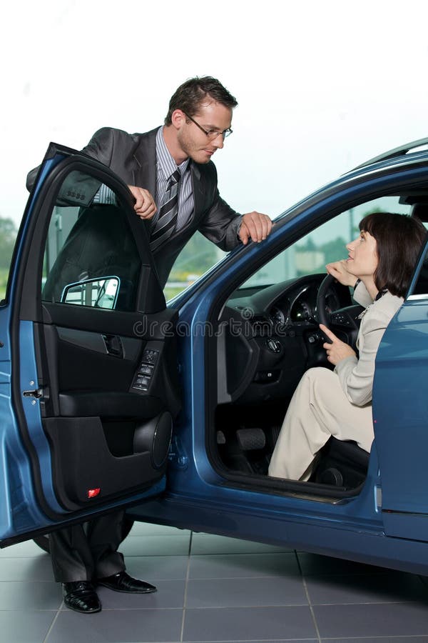 Car Salesperson Explaining Car Features To Customer Stock Image - Image ...