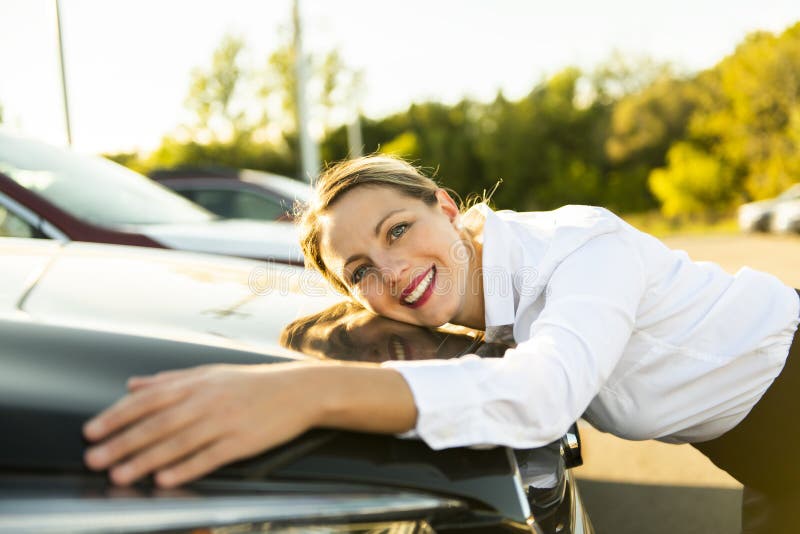 Car Seller Woman Hugging Car at the Garage Stock Image - Image of ...