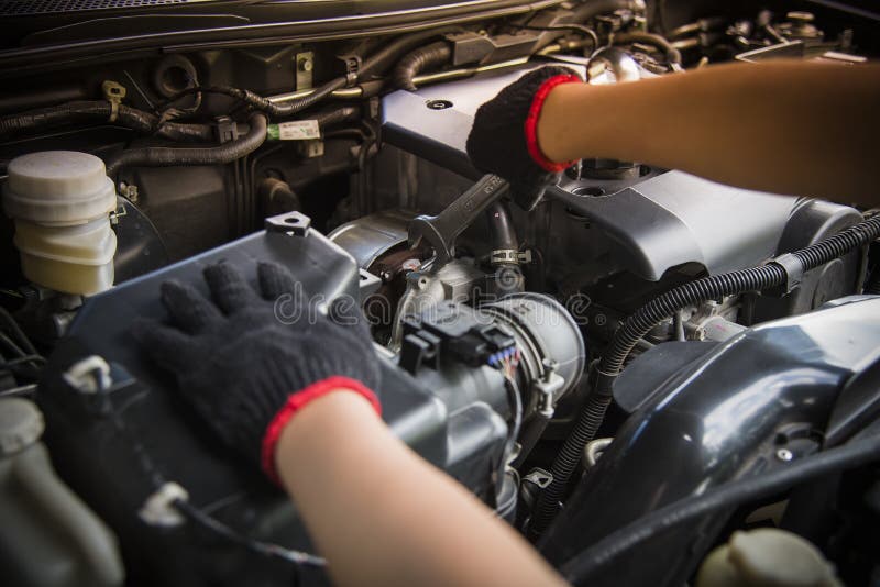 Car Service ,fitting a Car Engine Stock Photo - Image of garage, people ...