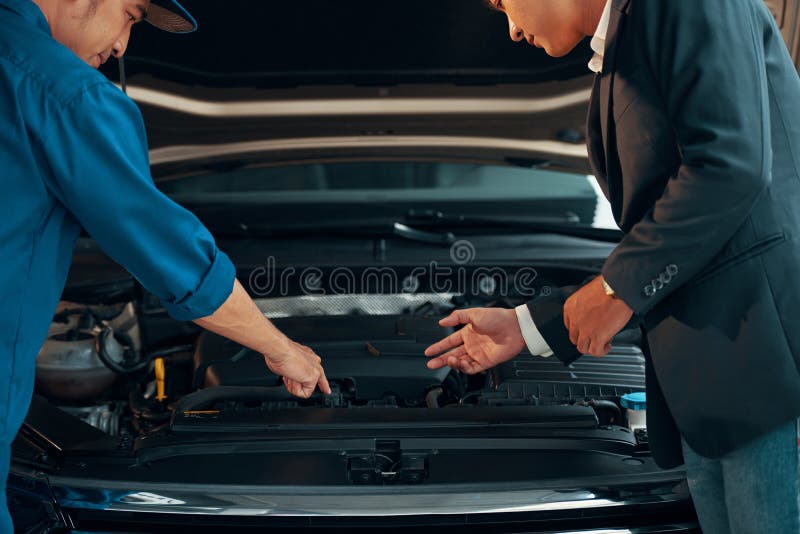 Mechanic helping customer stock image. Image of transportation - 122871427
