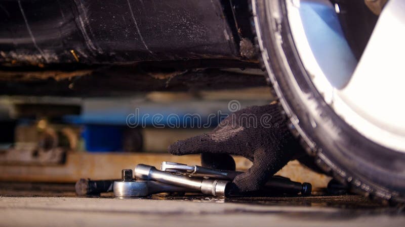 Mechanic, Reaching for Tools on a Tool Trolley in a Garage Stock Photo ...