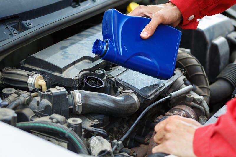Oil changing stock image. Image of pouring, container - 28335989