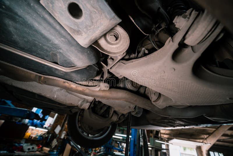 Car Service, Modern Car on a Lift. View of the Rear of the Car from ...